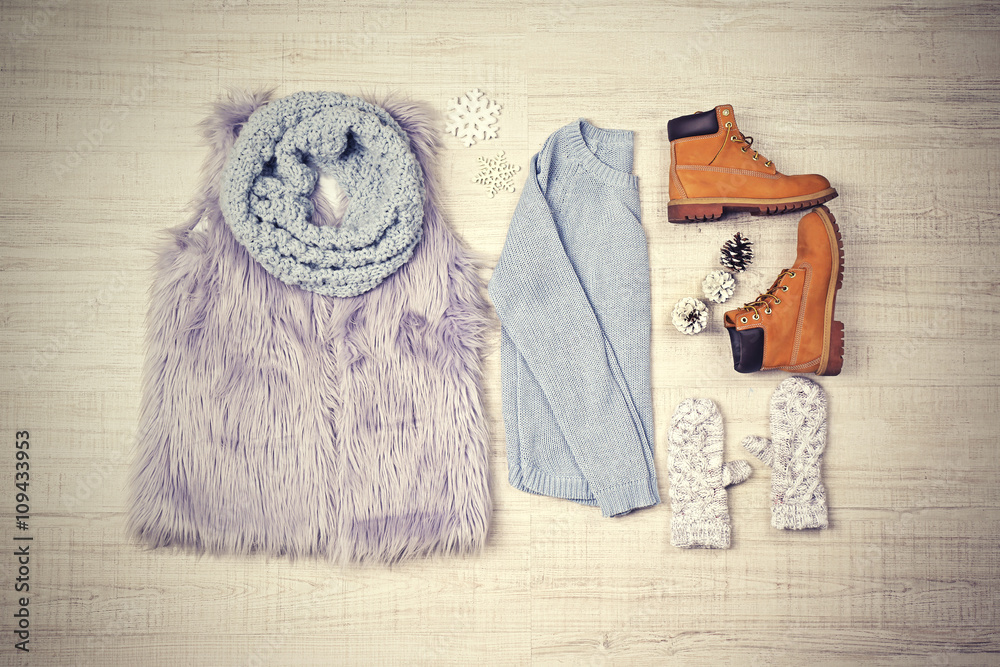Set of beautiful winter female clothes on wooden background Stock Photo ...