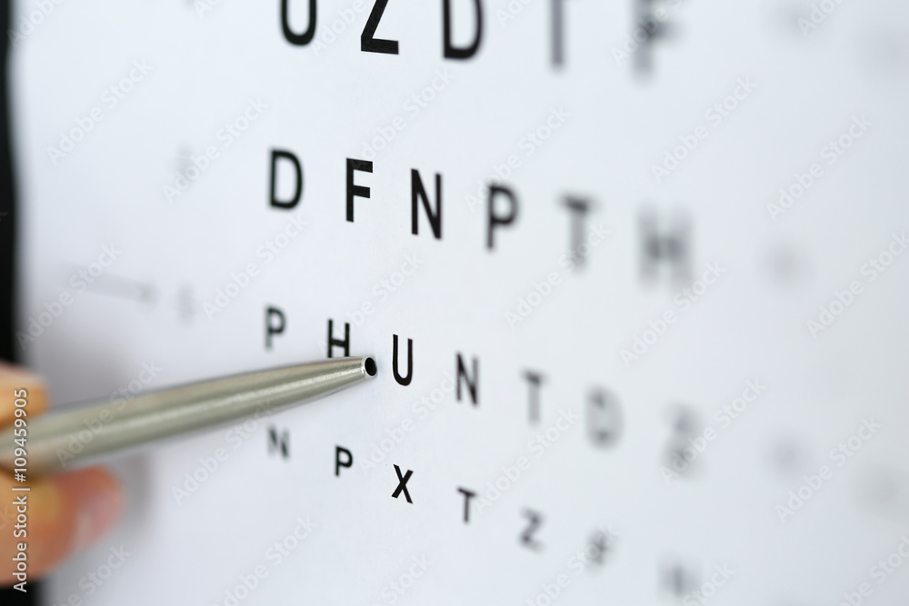 Silver ballpoint pen pointing to letter in eyesight check table Stock ...