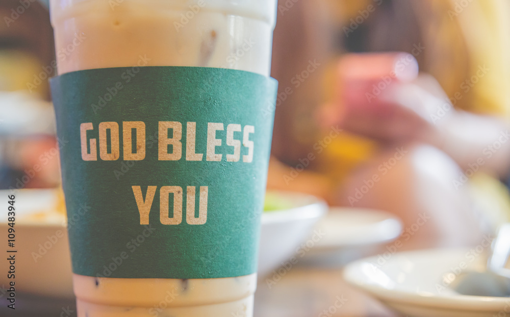 Iced coffee god bless you with milk is on the table. Stock Photo ...