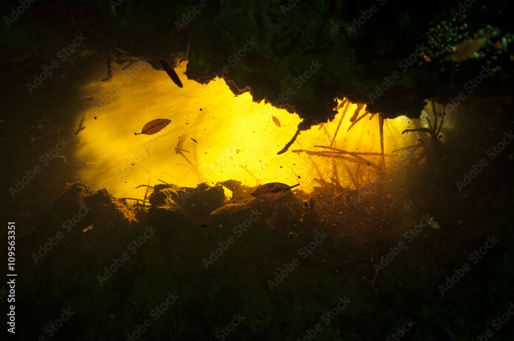 Water changing color as light from the surface passes through suspended ...