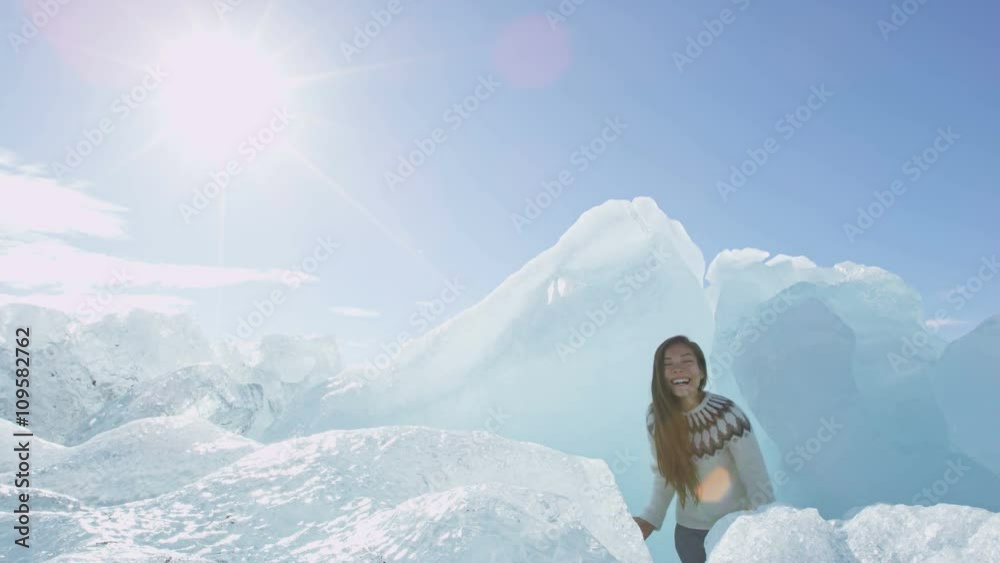 Iceland tourist at Jokulsarlon Iceberg beach having fun on icebergs on ...