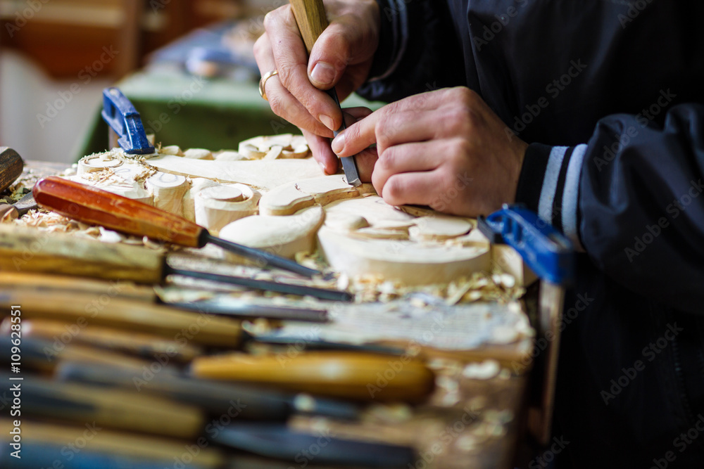 Carpenter hand carving wood with care Stock Photo | Adobe Stock