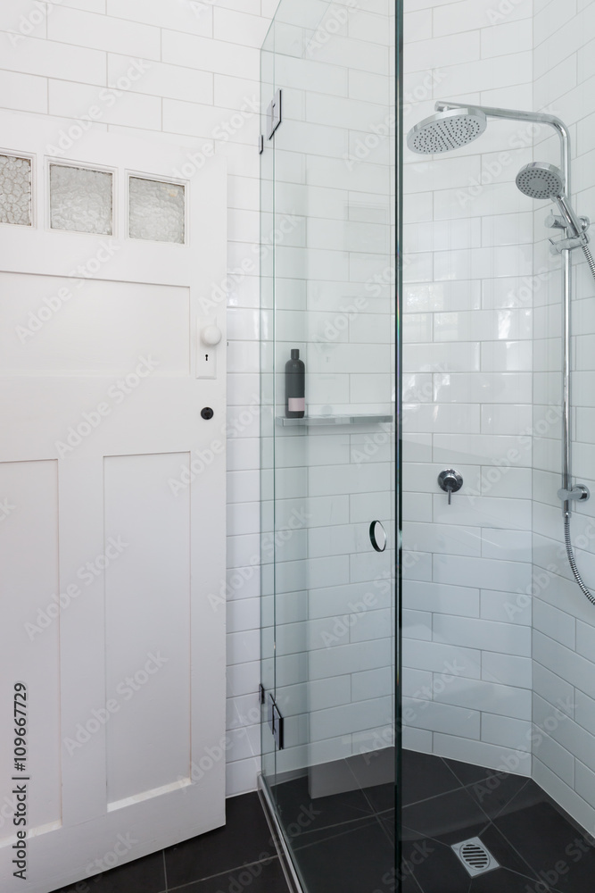 Modern white shower in bathroom renovation with brick pattern ti Stock ...
