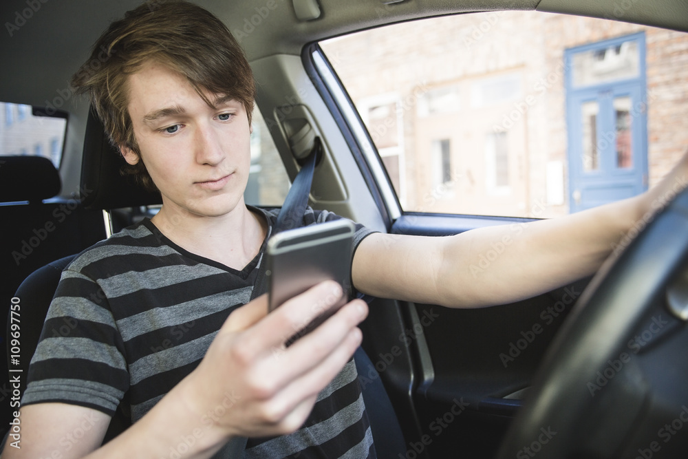 Teenage boy and new driver behind wheel of his car Stock Photo | Adobe ...