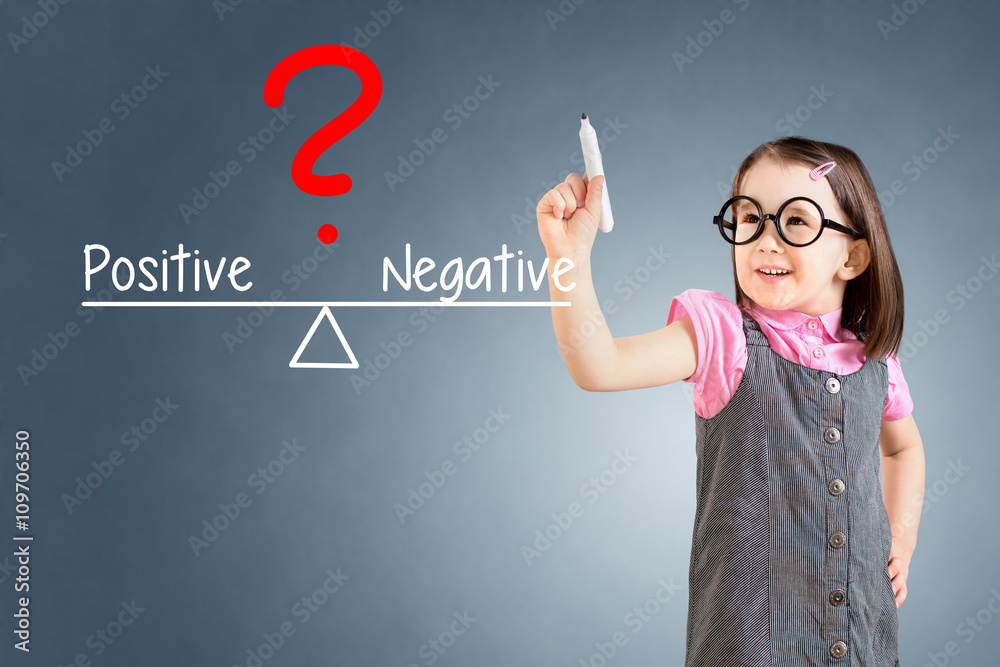 Cute little girl wearing business dress and writing positive and ...