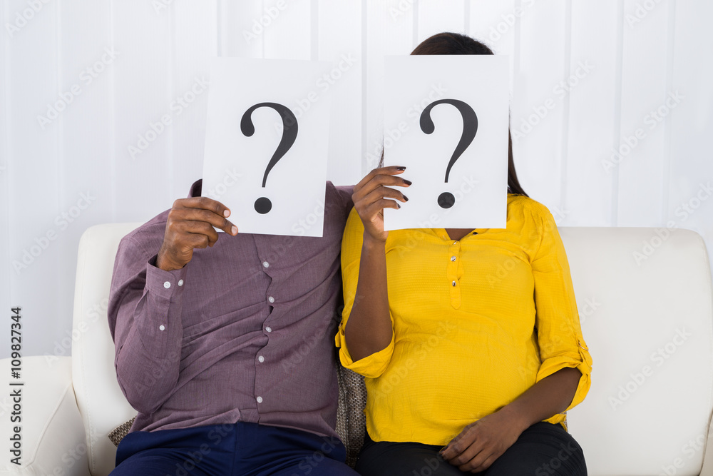 Couple Holding Question Mark Sign In Front Of Face Stock Photo | Adobe ...