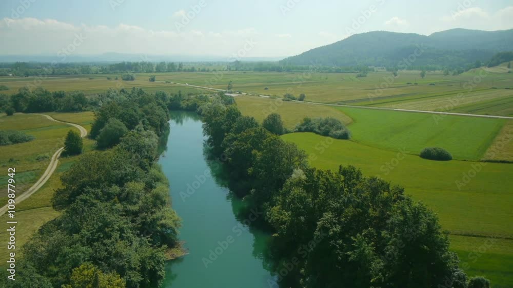 Aerial perspective 45 degree face down, flight backwards along the flat ...