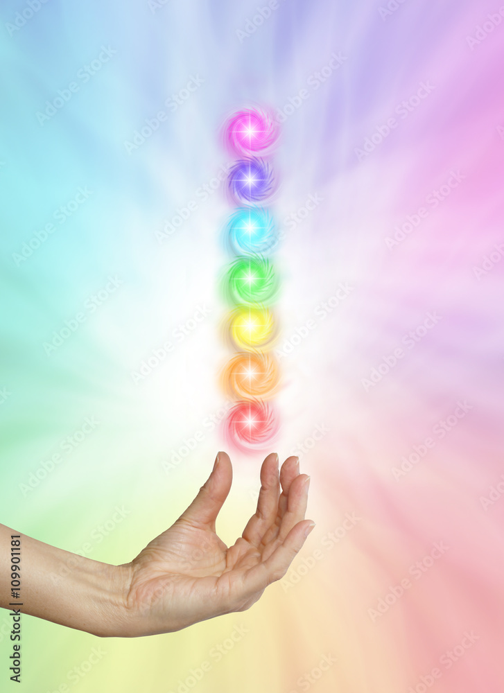 Seven Spinning Chakras on Rainbow colored background - Female healing ...
