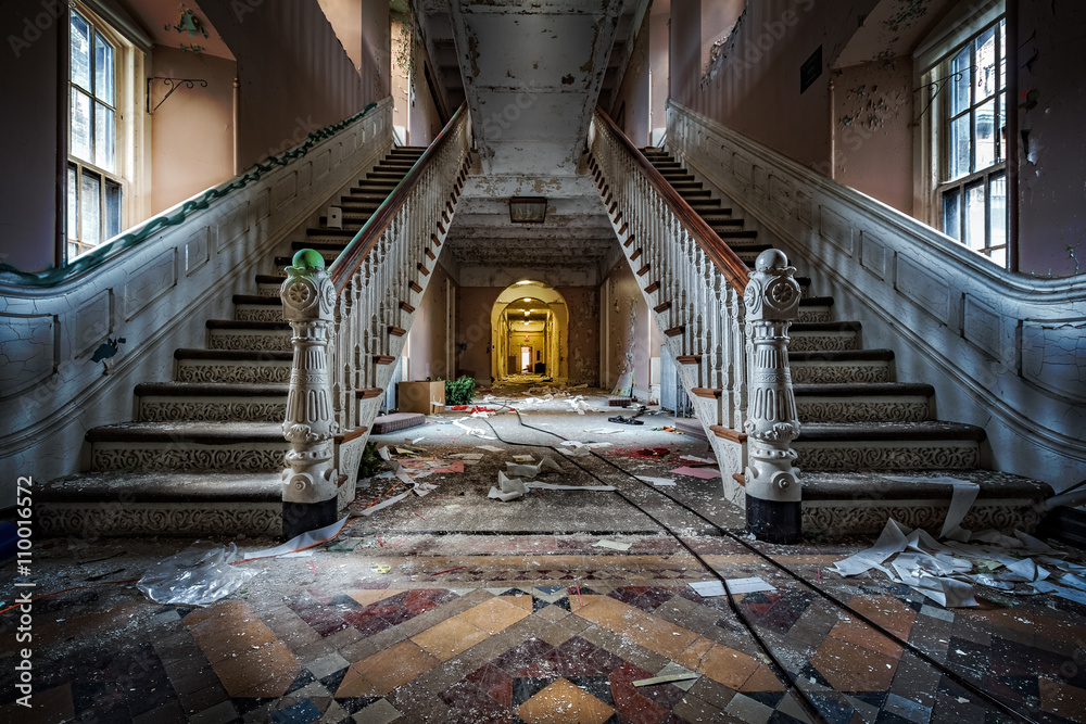 Main entrance with symmetrical stairs of an abandoned psychiatric ...