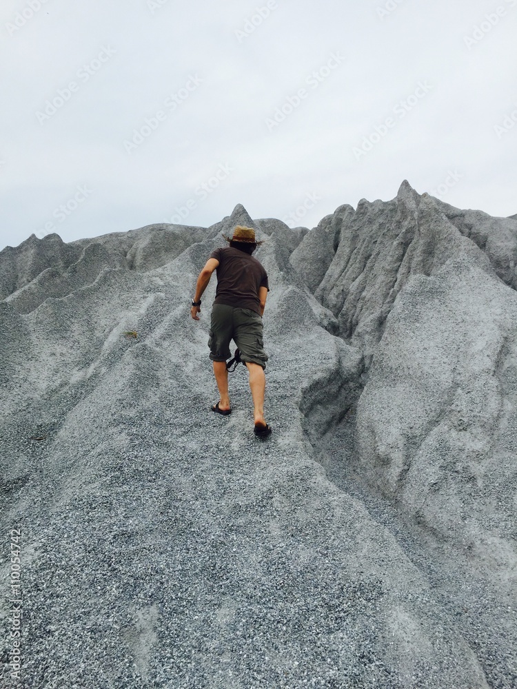 man walk up the hill Stock Photo | Adobe Stock
