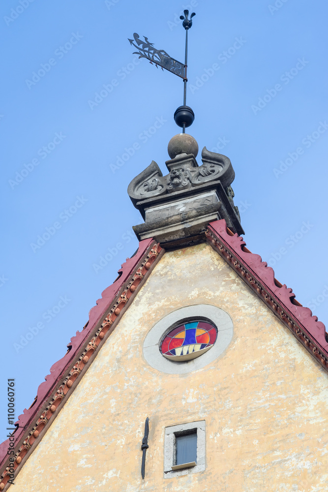 Wind-vane on roof top of medieval house Stock Photo | Adobe Stock