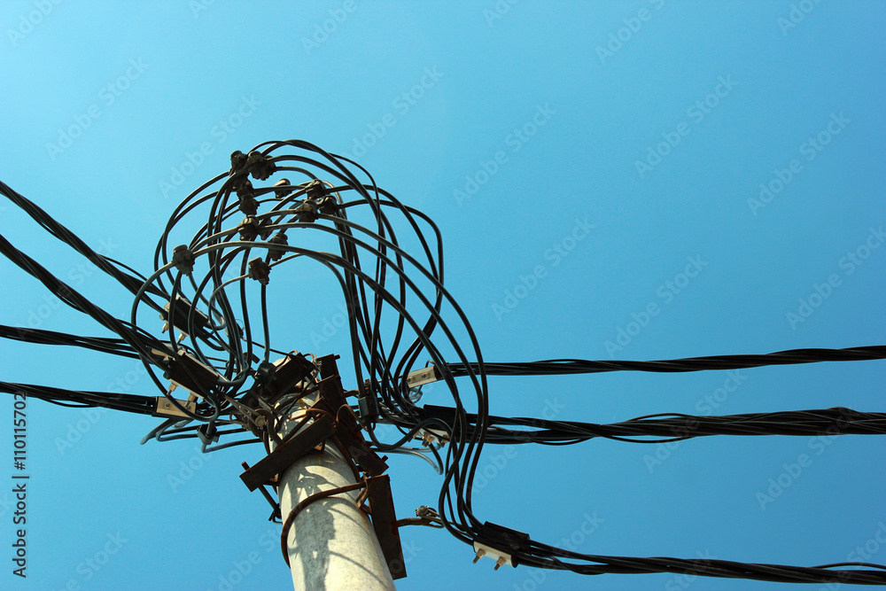 Powerline insulators, connectors and tangled wires on electrical pole ...