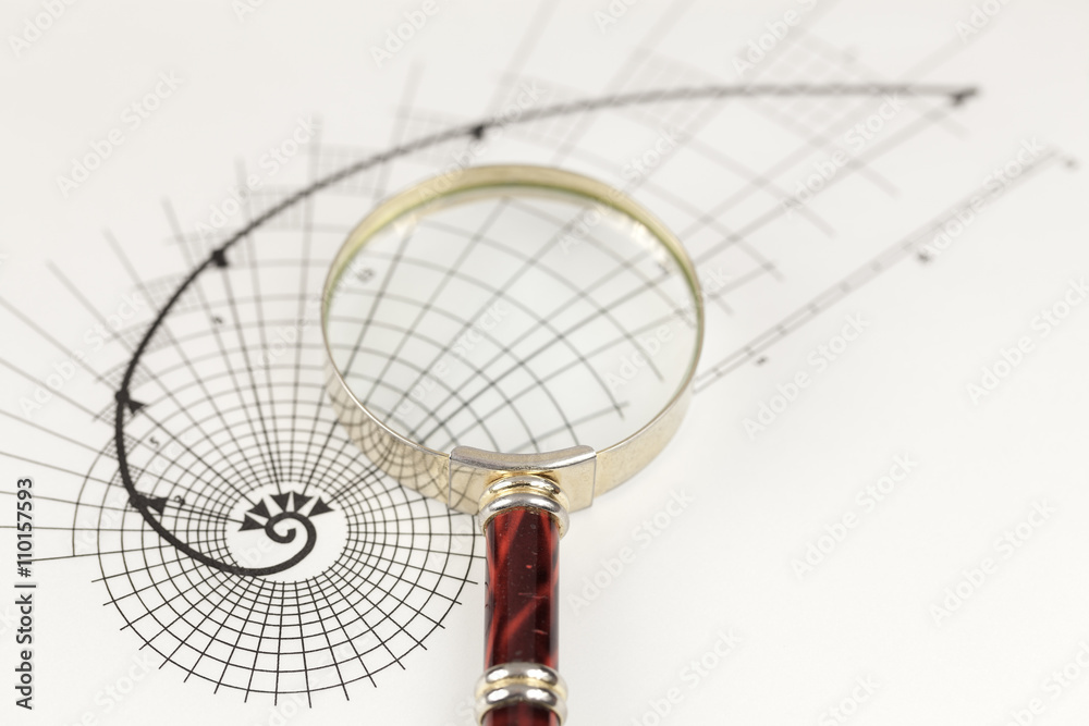 magnifying glass & drawing of the golden section Stock Photo | Adobe Stock