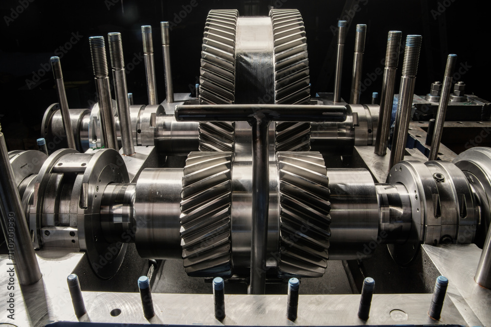A part of a small steam turbine. Metal gears. Gear wheels of the engine ...