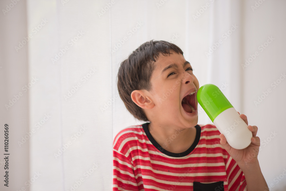 Little boy taking medicine drug Stock Photo | Adobe Stock