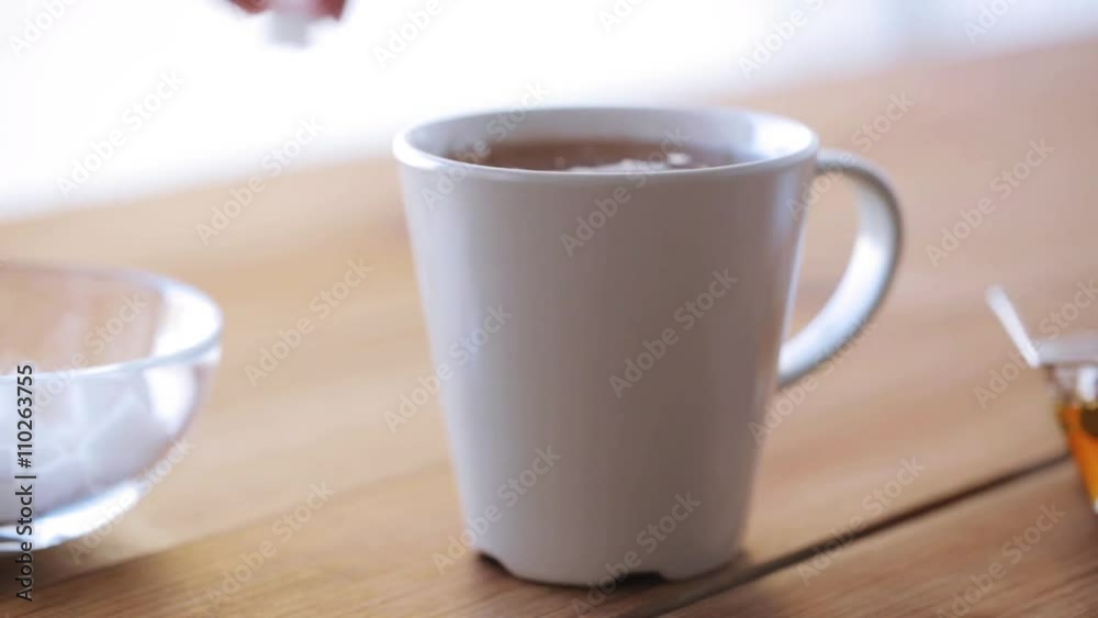 hand adding sugar to cup of tea or coffee Stock-Video | Adobe Stock