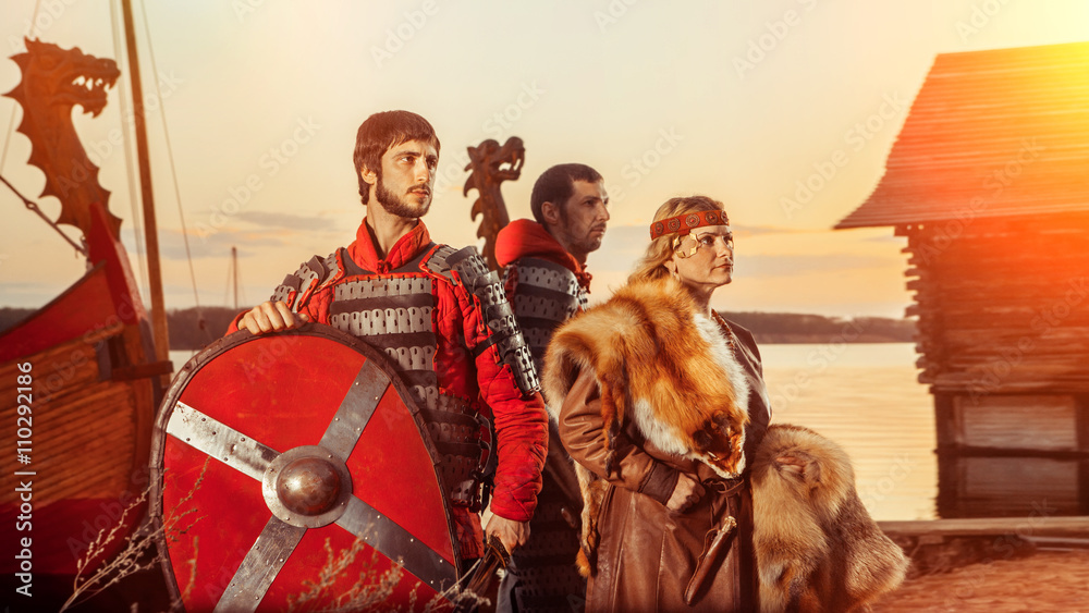 Slavic princess and two warriors with swords and shields on the ...