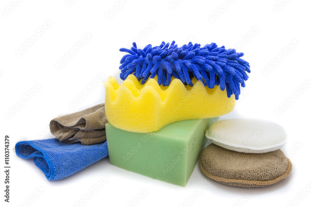 Yellow, green sponges and blue mitts for washing and microfiber fabric ...