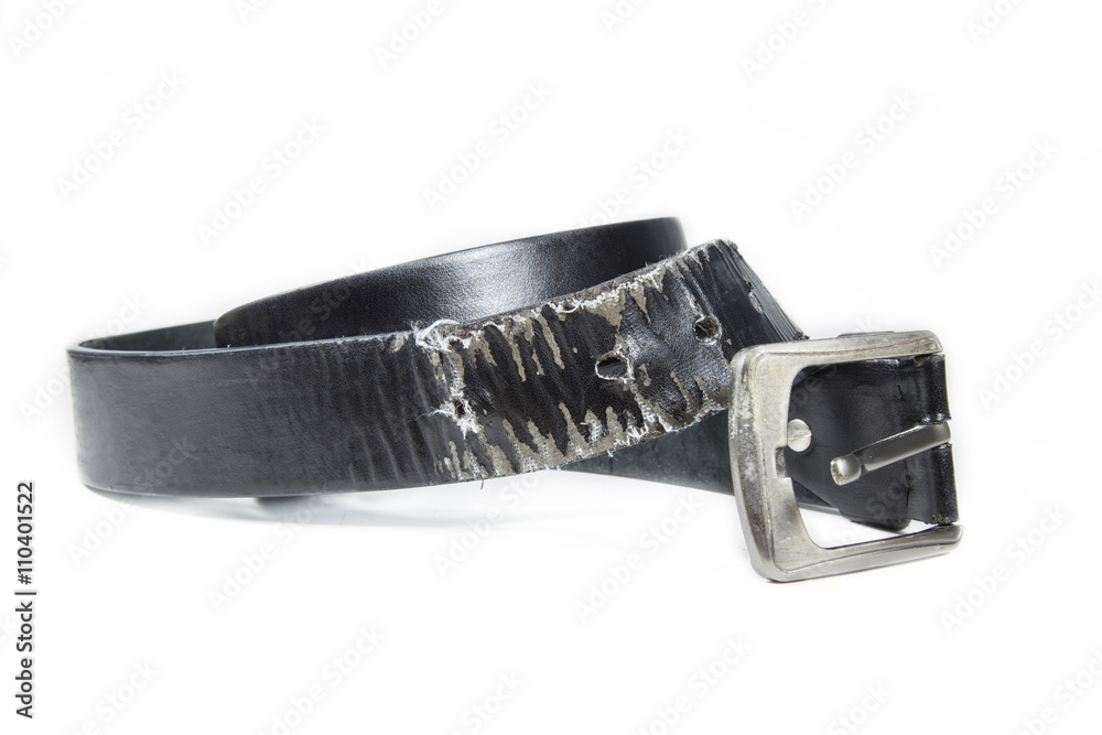 Old leather belt torn on white background. Stock Photo | Adobe Stock