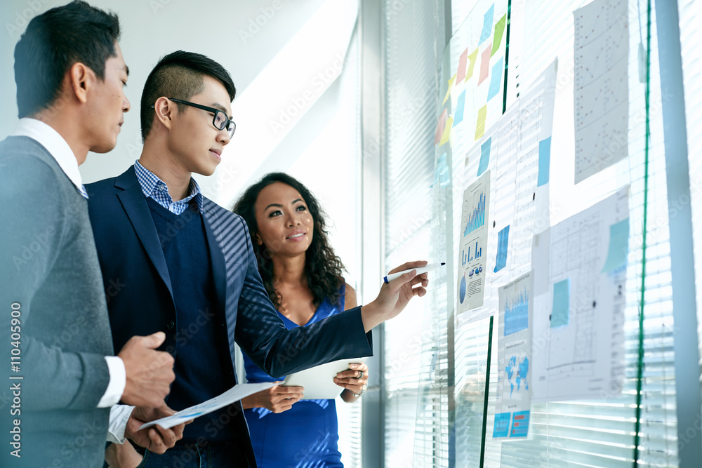 Analyzing charts and graphs Stock Photo | Adobe Stock