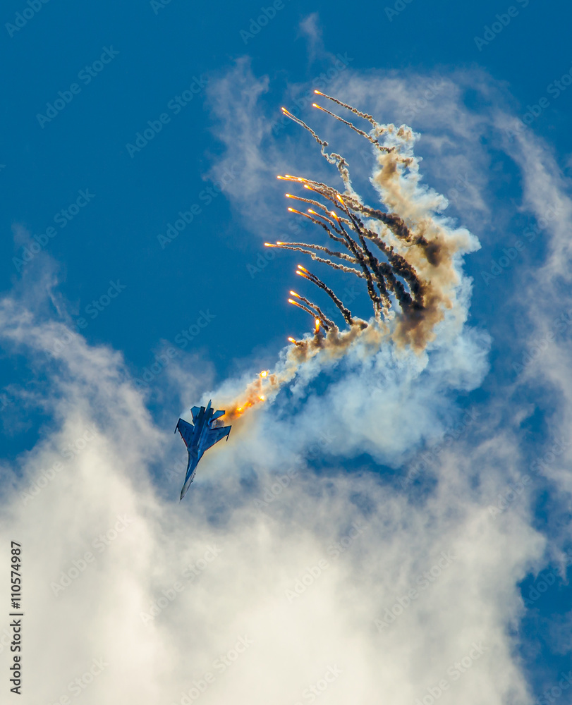 Military aircraft fighter SU-27 nose-dive, performs the maneuver with ...