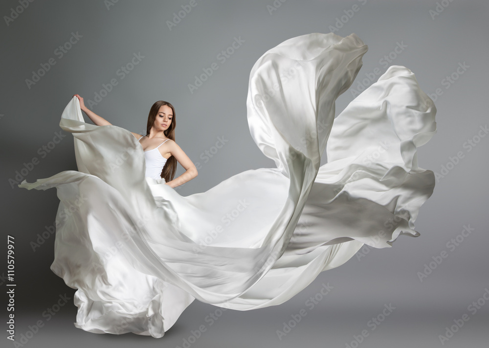 beautiful young girl dancing. The girl in flying white dress. A white ...