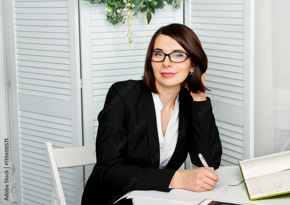 Smiling therapist taking notes on white background. Portrait of a ...