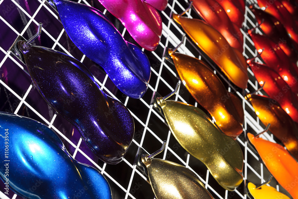 Car metallic paint samples, stand with examples of glowing colors ...