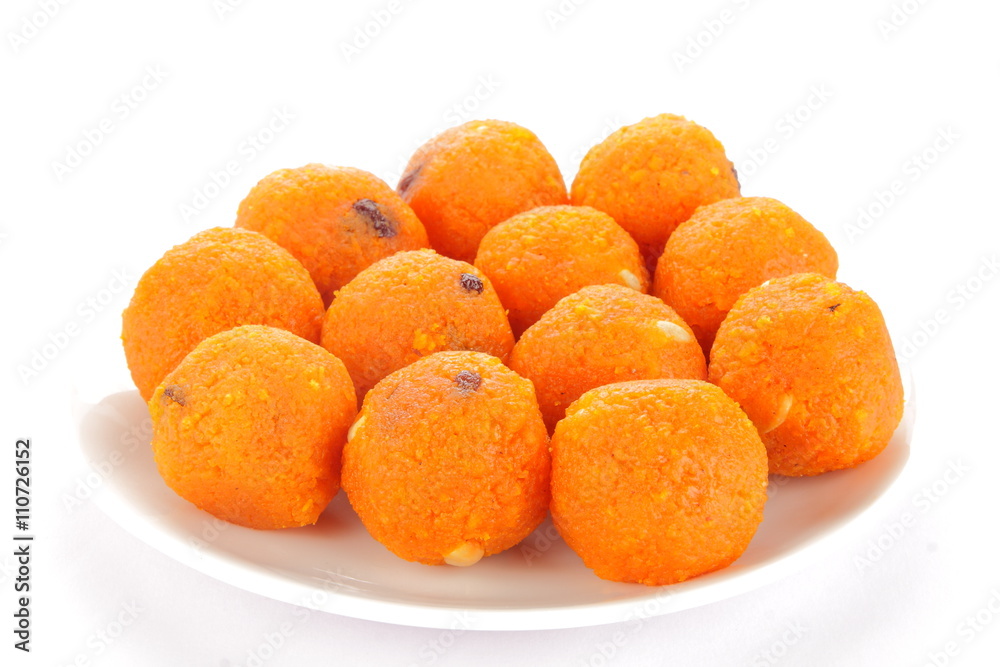 Plate of tasty Red Diwali sweets Ladoo or bundi laddu in leaf. Stock ...