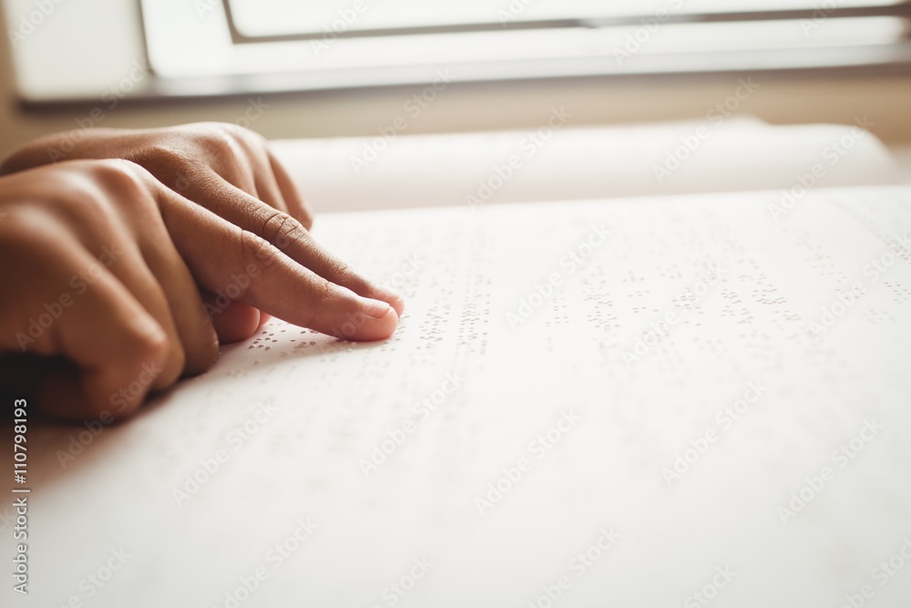 Child using braille to read Stock Photo | Adobe Stock
