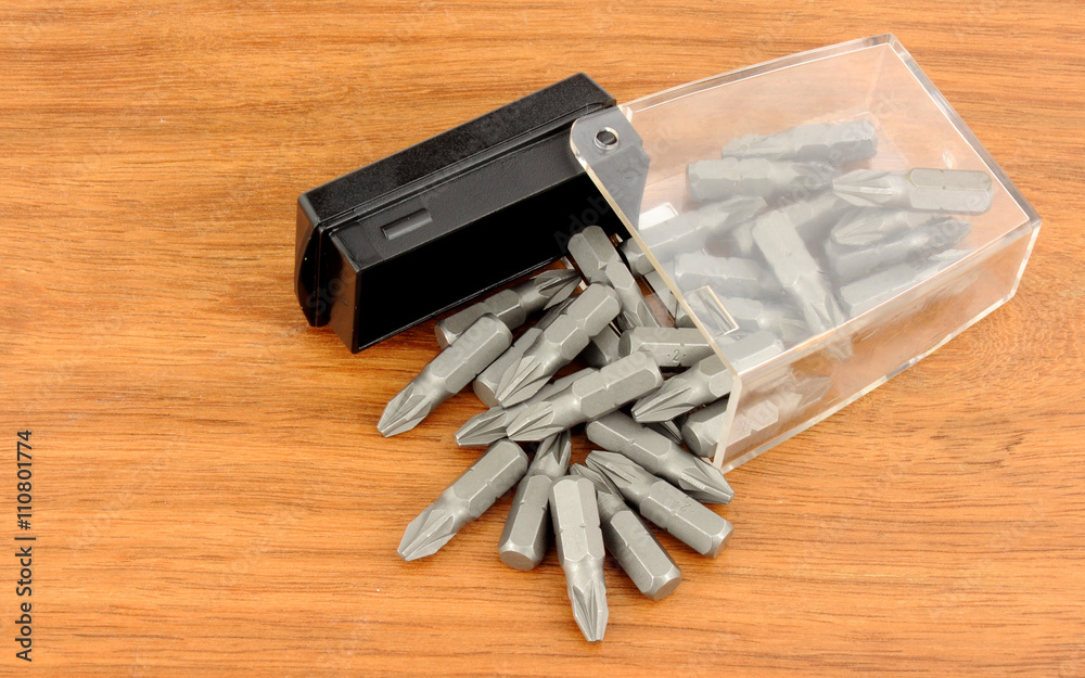 Box Of Screwdriver Bits On Wood Background Stock Photo | Adobe Stock