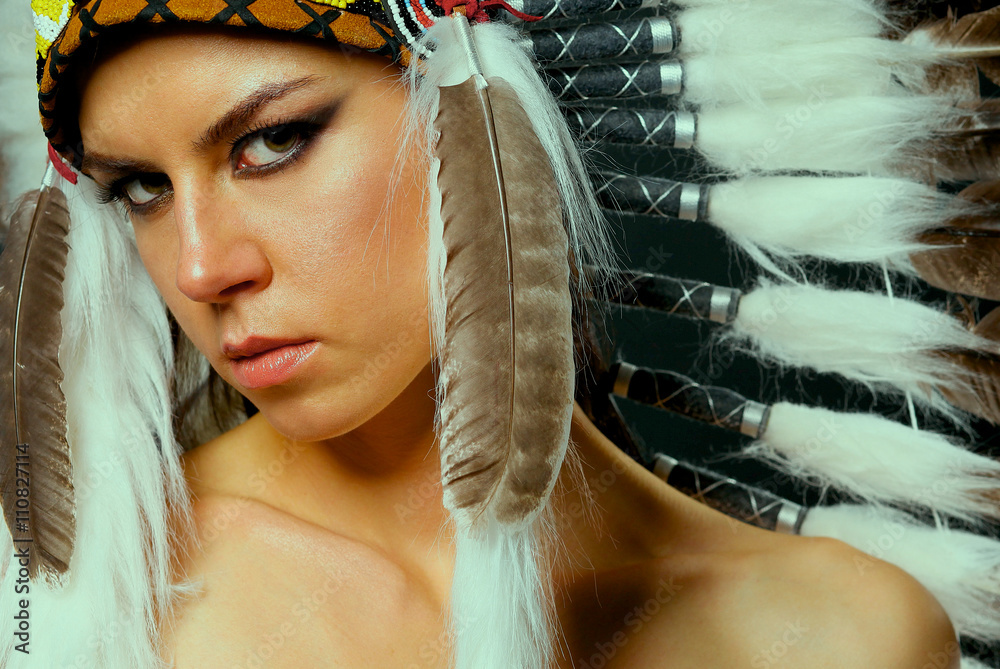 Beautiful woman in native american costume with feathers Stock Photo ...