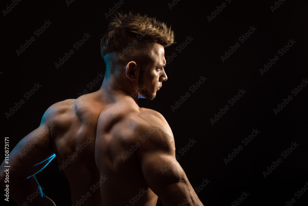 Strong Athletic Fitness Man posing back muscles, triceps, latissimus ...