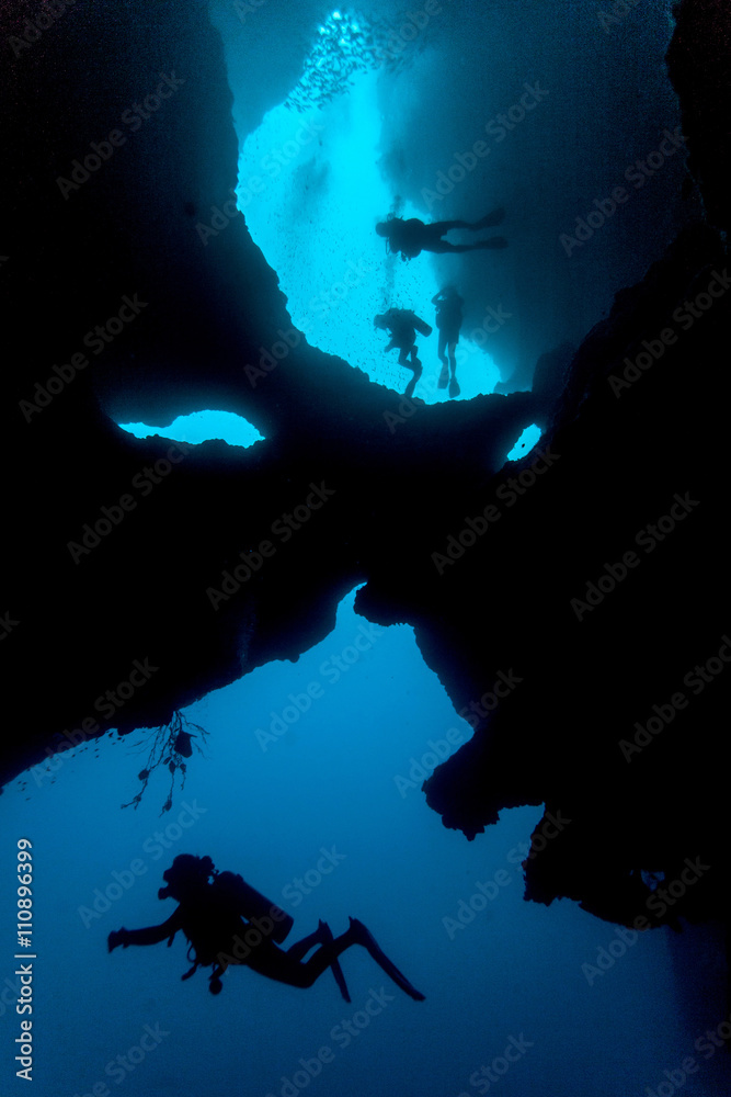 Diver swimming in cave system, Moalboal, Cebu, Philippines Stock Photo ...