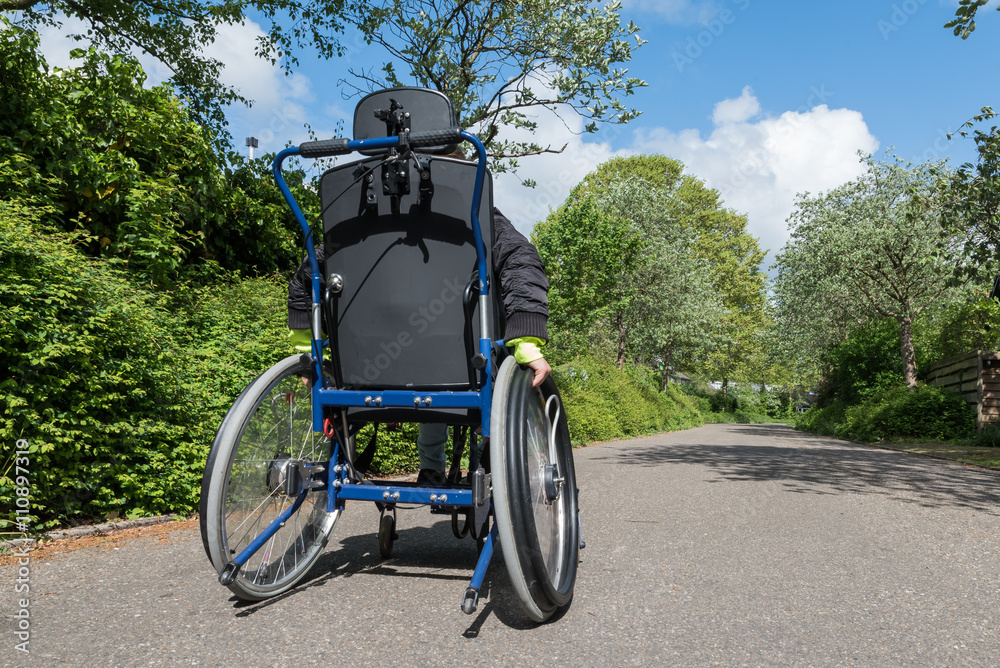 Disabled mobility in a wheelchair / Disabled person with her hands on ...
