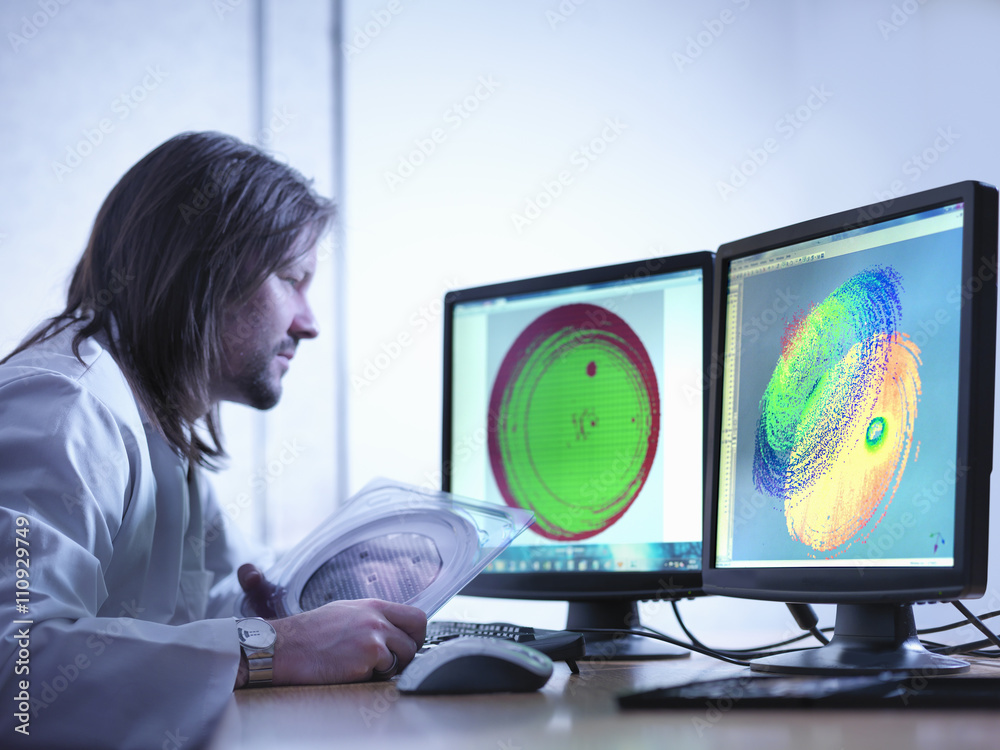Scientist checking test map of silicon wafer in laboratory Stock Photo ...