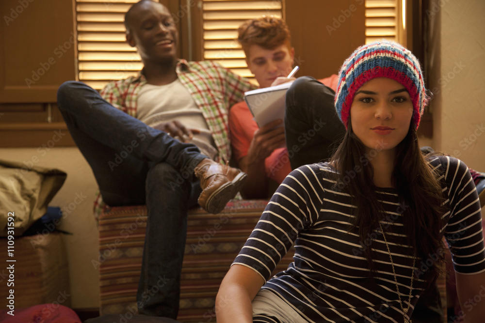 Students chilling out and studying in living room Stock Photo | Adobe Stock