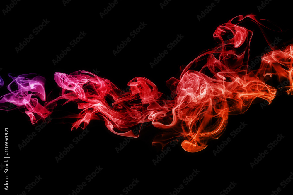 Colored abstract smoke, isolated on black background. Photo. Acid neon ...