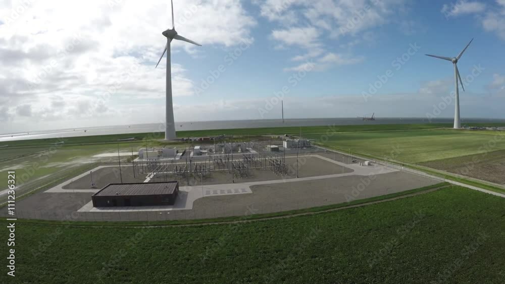 Aerial of wind turbine control center of wind park bird eye helicopter ...