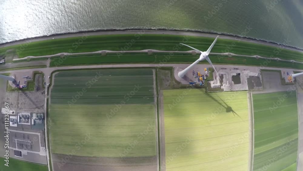 Aerial of wind turbine view from above top down bird eye view on green ...