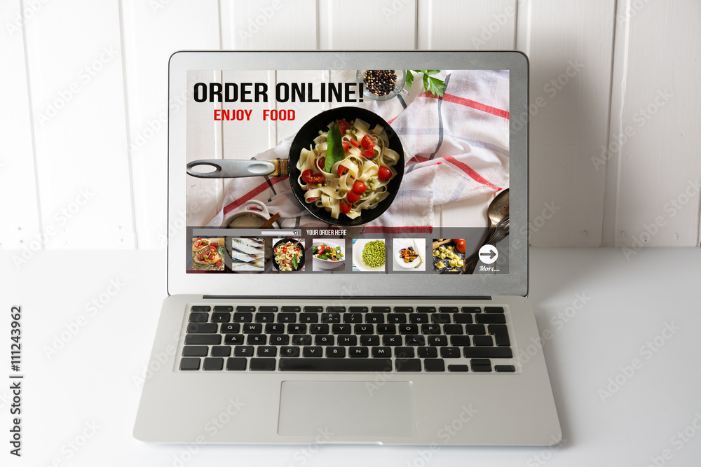 Computer with Online food delivery app on screen. lifestyle conc Stock ...