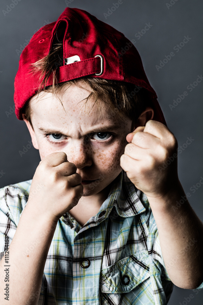 scary kid with freckles and hat back boxing and bullying Stock Photo ...