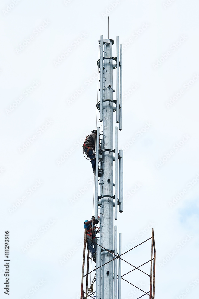 SELANGOR, MALAYSIA - MAY 21, 2016: Riggers are working at top of the ...