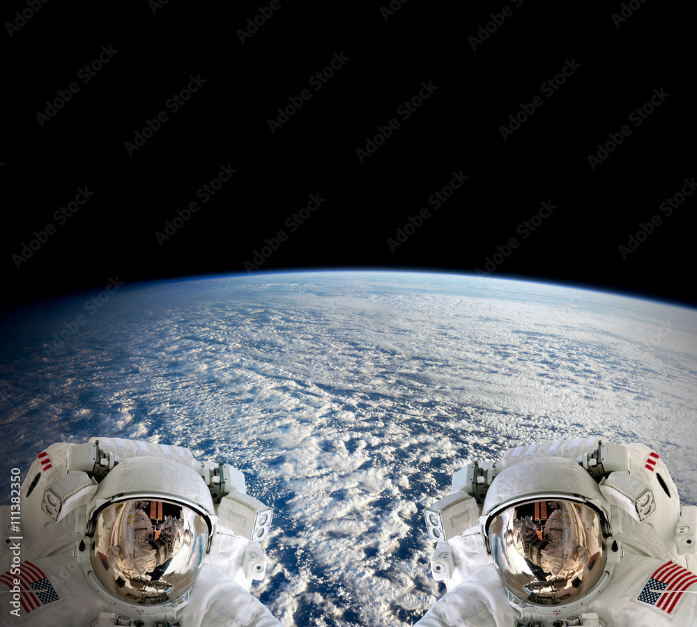 High resolution planet Earth two astronauts spaceman helmet suit ...