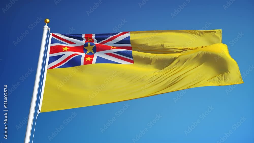 Niue flag waving in slow motion against clean blue sky, seamlessly ...