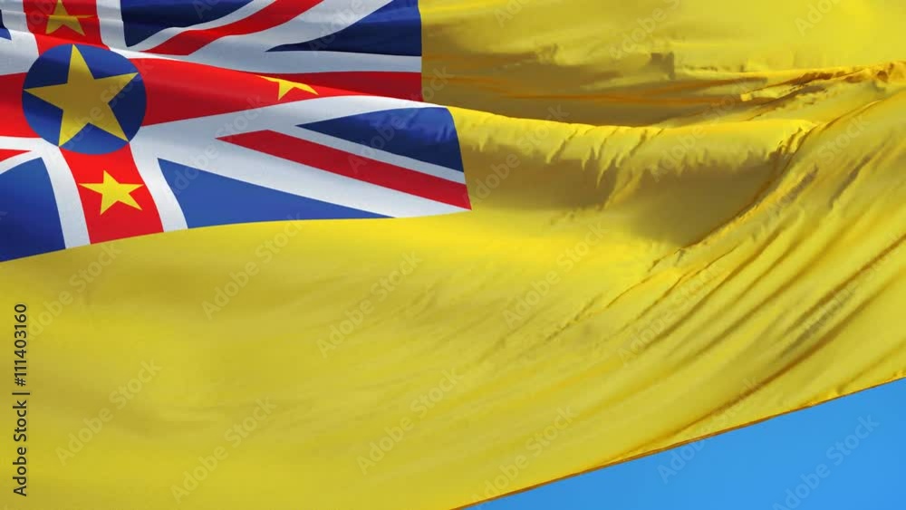 Niue flag waving in slow motion against clean blue sky, seamlessly ...