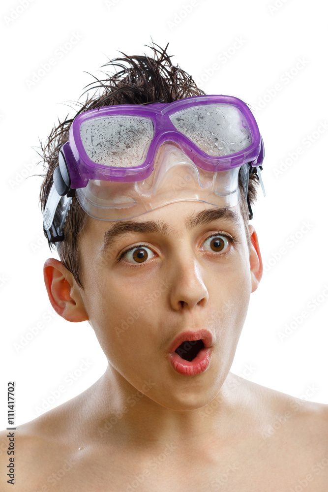Boy diver in swimming mask with a happy face close-up portrait ...