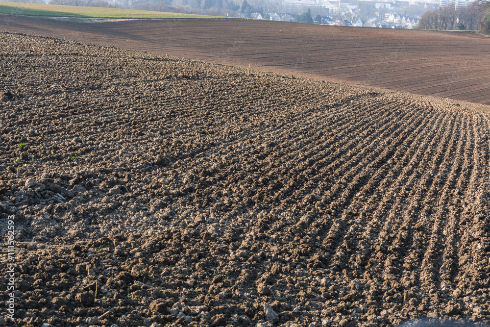 Gepflügter Acker mit Ackerfurchen Stock-Foto | Adobe Stock