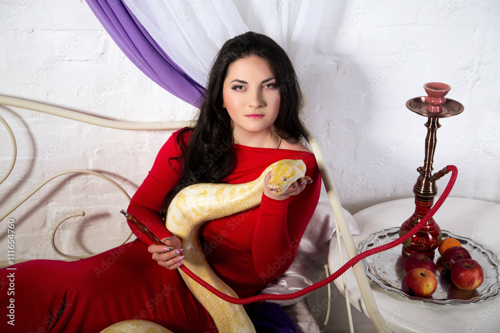 Beautiful sexy girl holding a white albino python Stock Photo | Adobe Stock