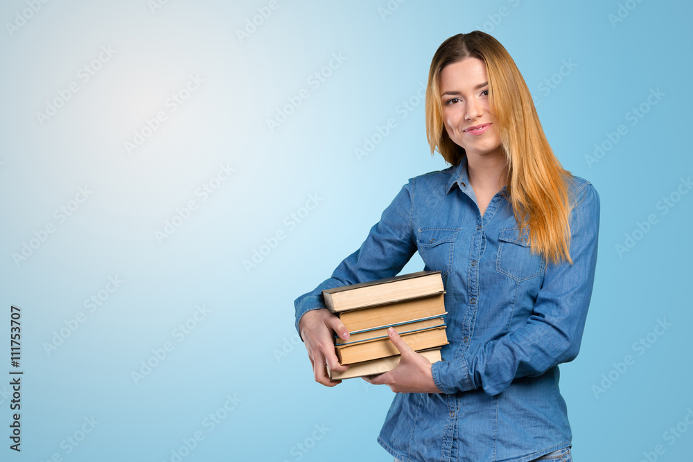 young girl with books Stock Photo | Adobe Stock